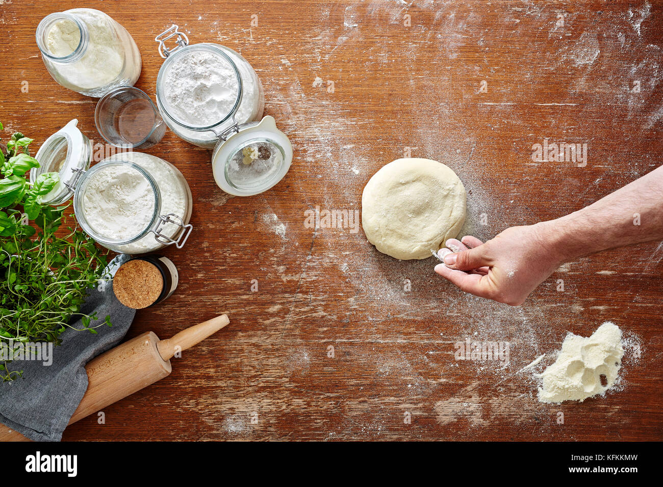 hand flouring dough wooden kitchen surface atmospheric baking Stock ...