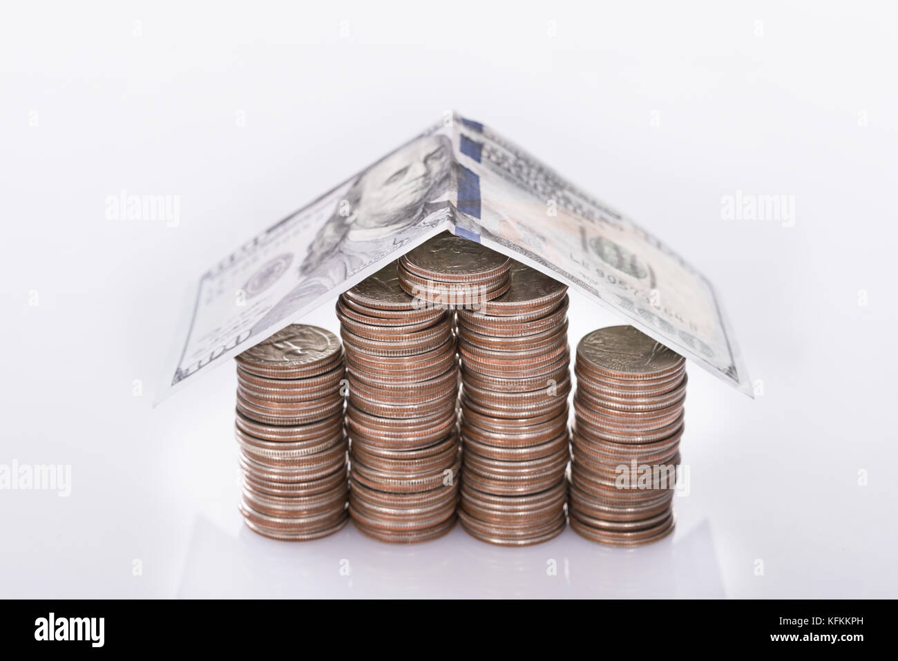 House made from coins. Isolated on white Stock Photo - Alamy