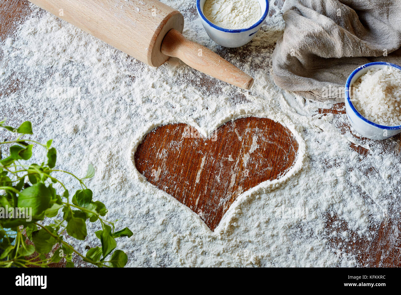 heart brushed in flour scene Stock Photo - Alamy