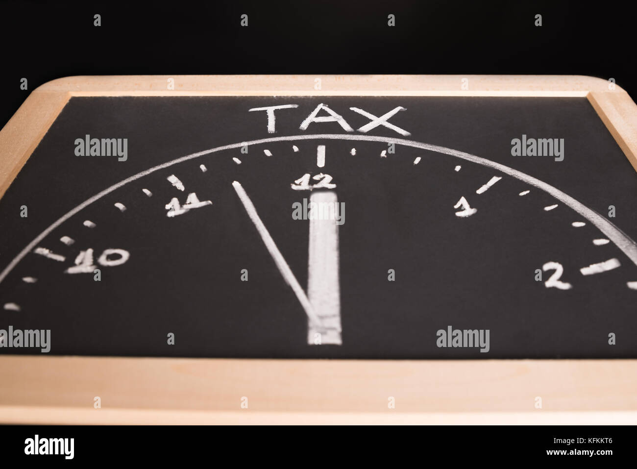 Tax time drawing written on small blackboard Stock Photo - Alamy