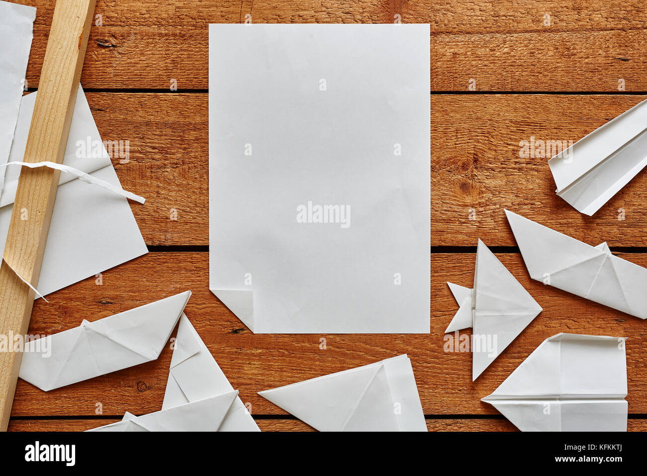 sheet of paper in the center of folded objects Stock Photo - Alamy