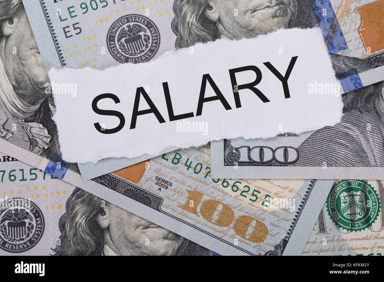 Closeup of Salary sign on dollar bills Stock Photo - Alamy