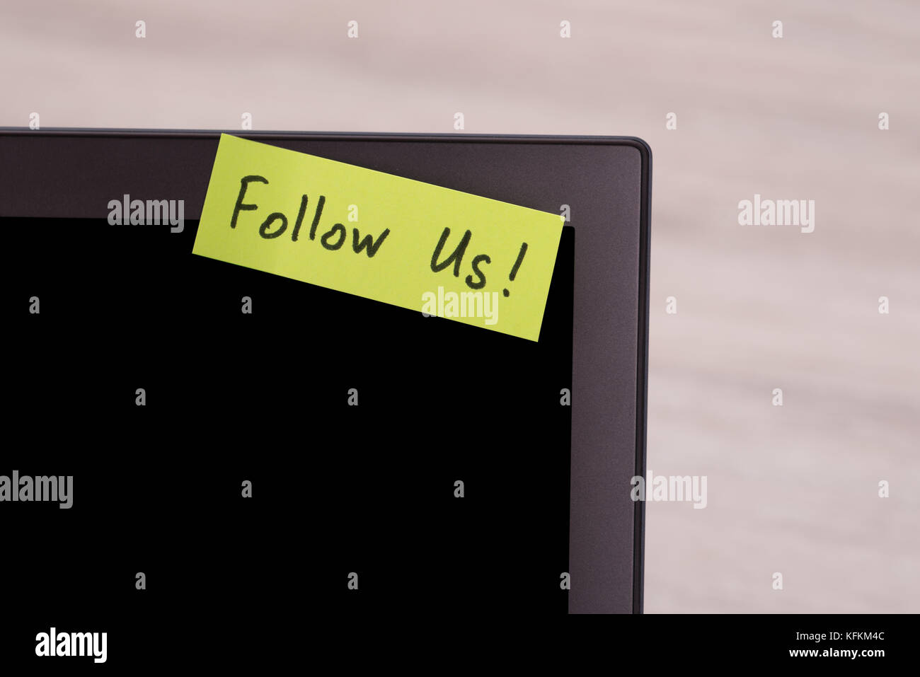 Closeup of Follow Us ! sticky note message on laptop screen Stock Photo ...