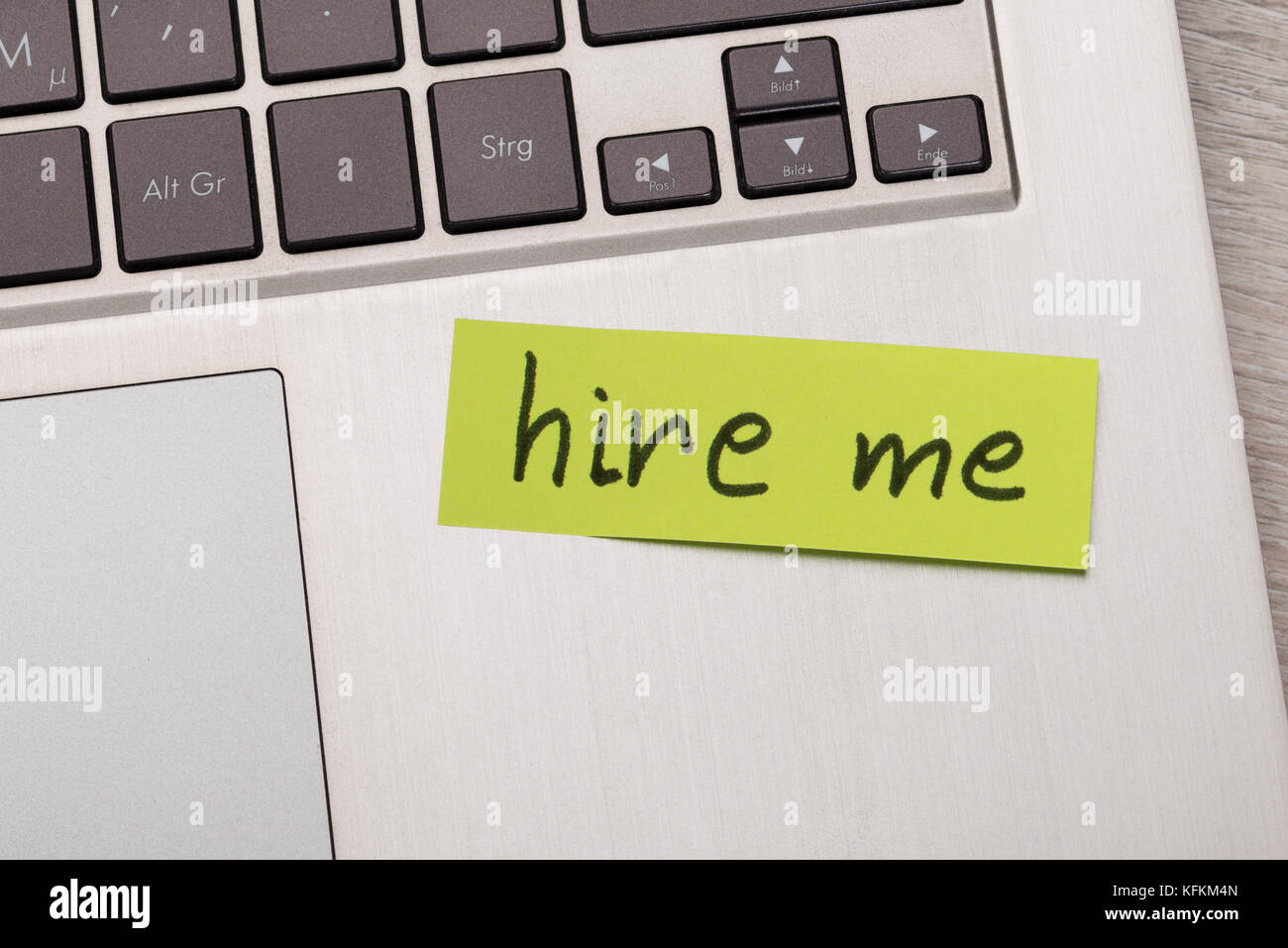 Closeup of Hire Me sticky note message on laptop Stock Photo - Alamy