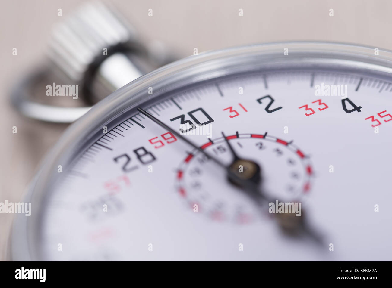 Closeup photo of stopwatch on wooden table Stock Photo - Alamy