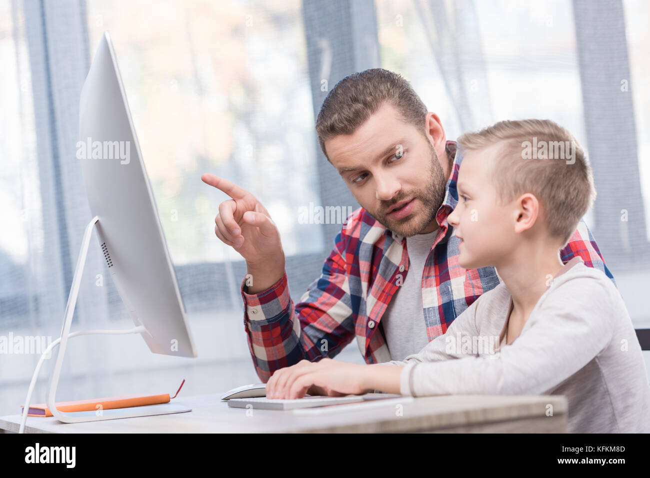 father and son with desktop computer Stock Photo - Alamy