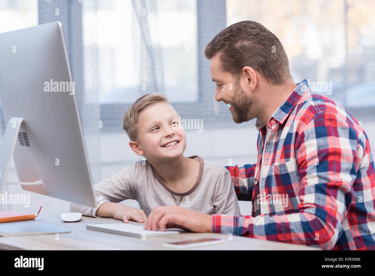 father and son with desktop computer Stock Photo - Alamy