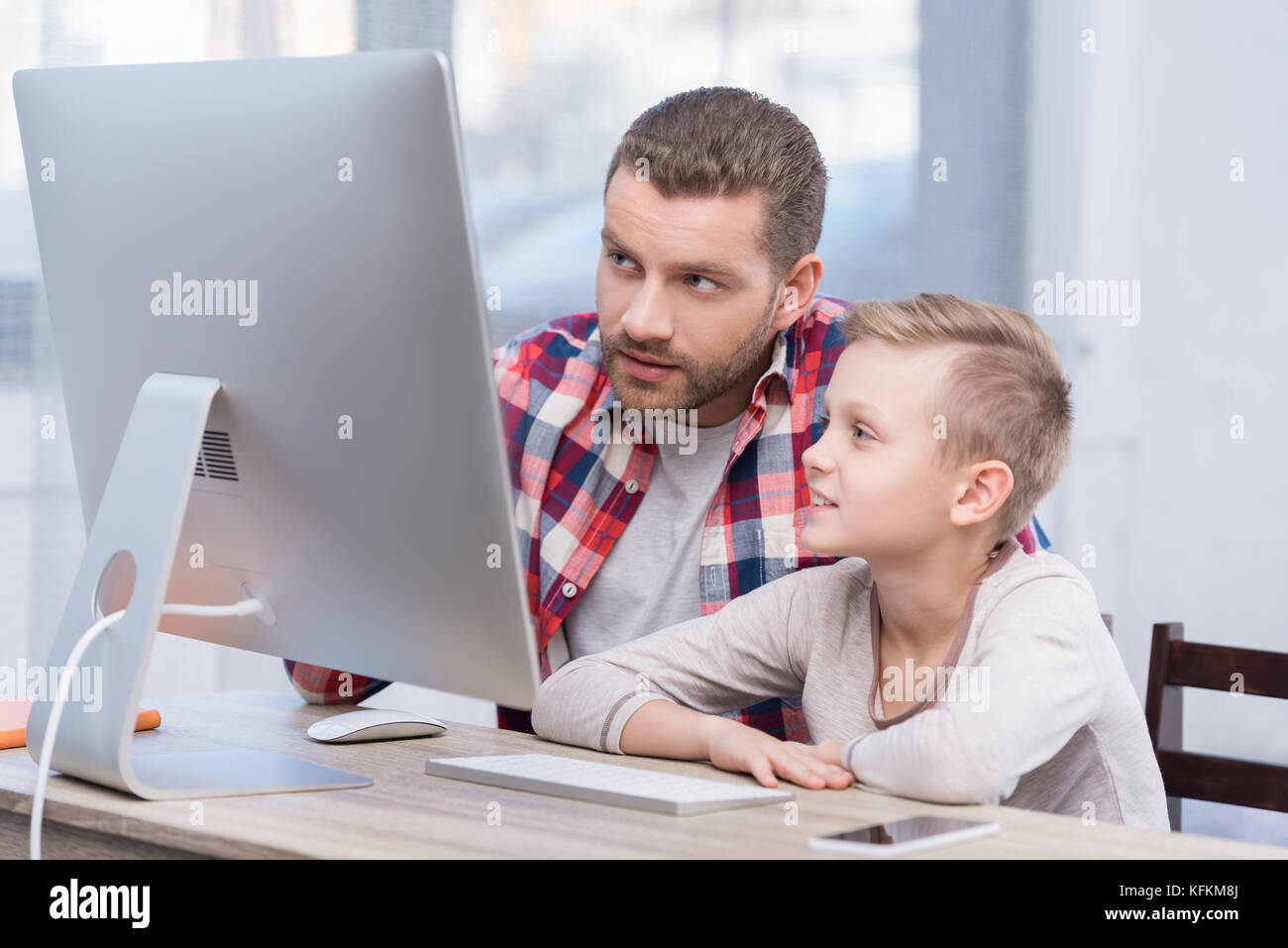 father and son with desktop computer Stock Photo - Alamy