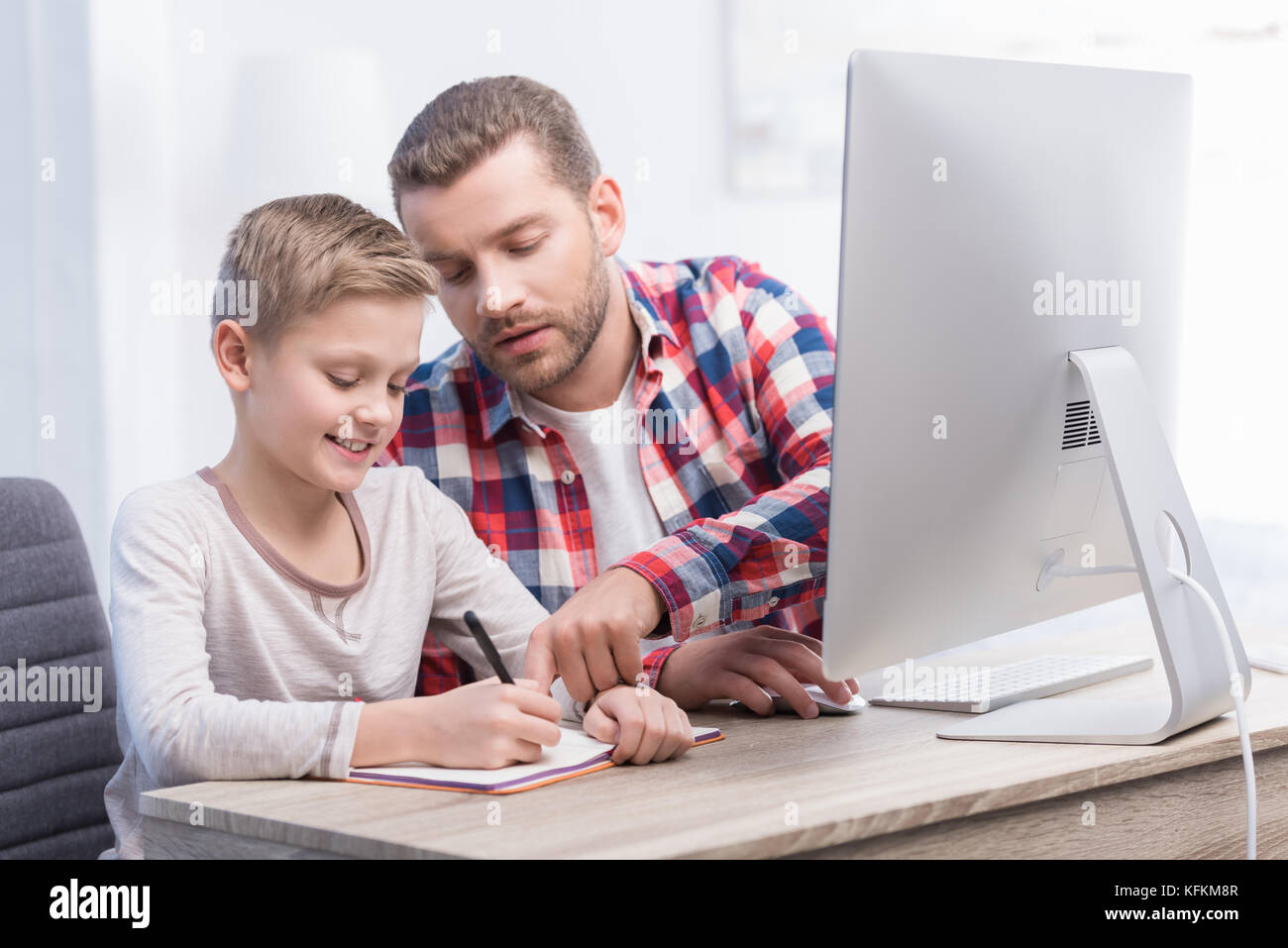 father and son with desktop computer Stock Photo - Alamy