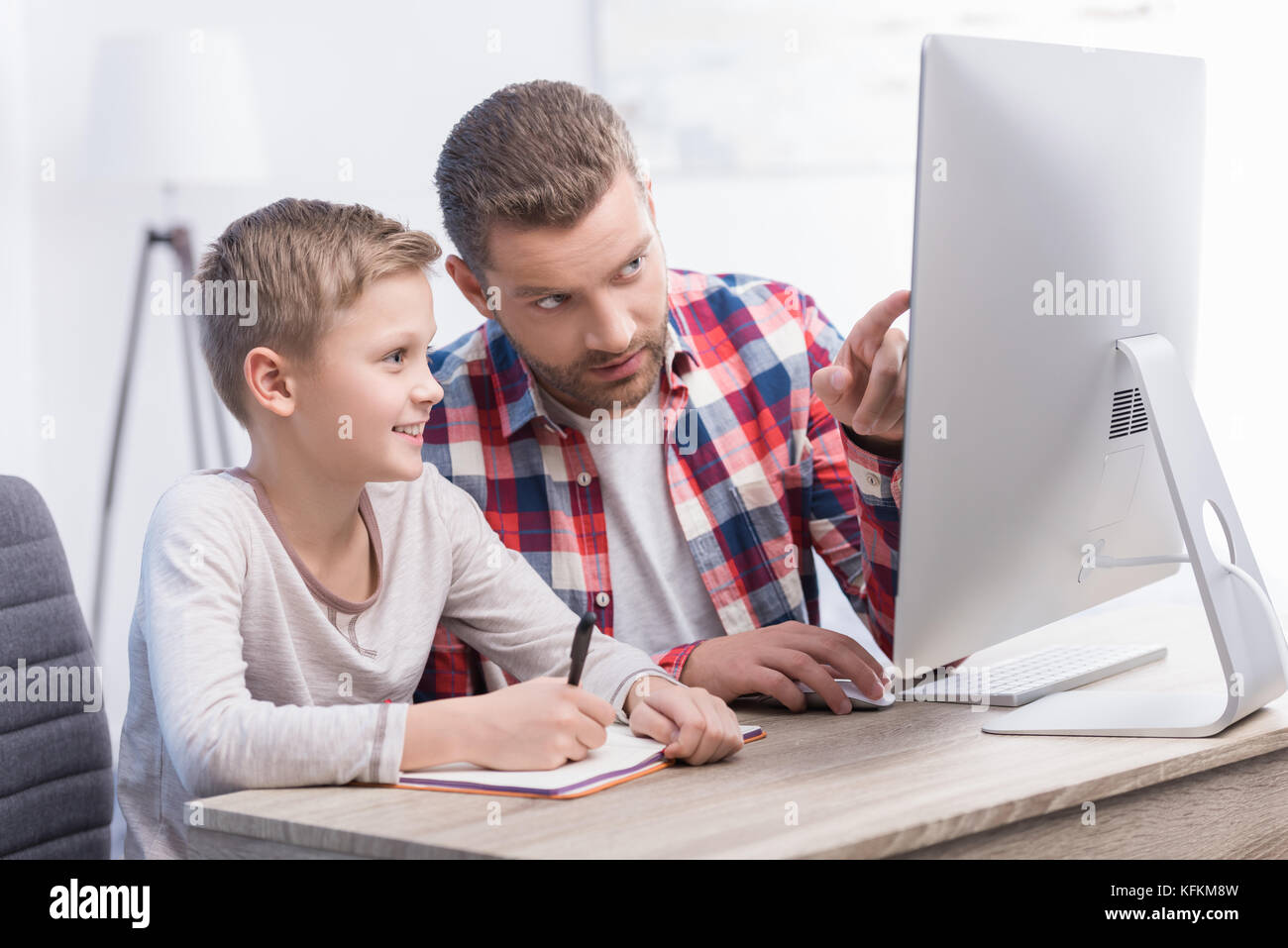 father and son with desktop computer Stock Photo - Alamy