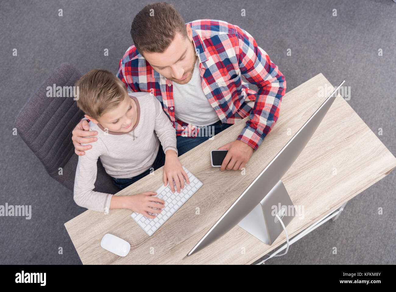 father and son with desktop computer Stock Photo - Alamy