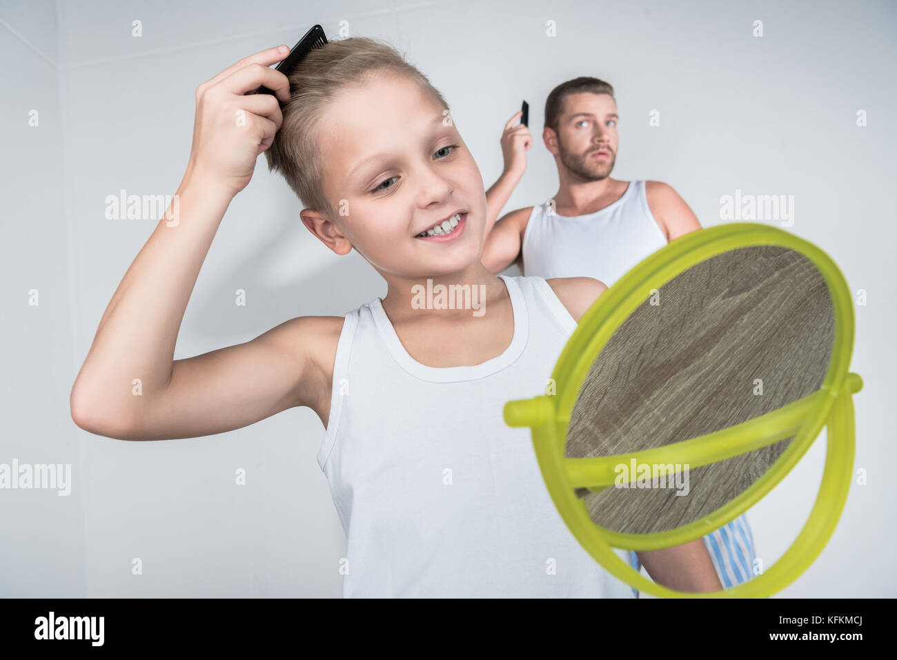 Boy combing hair hi-res stock photography and images - Alamy