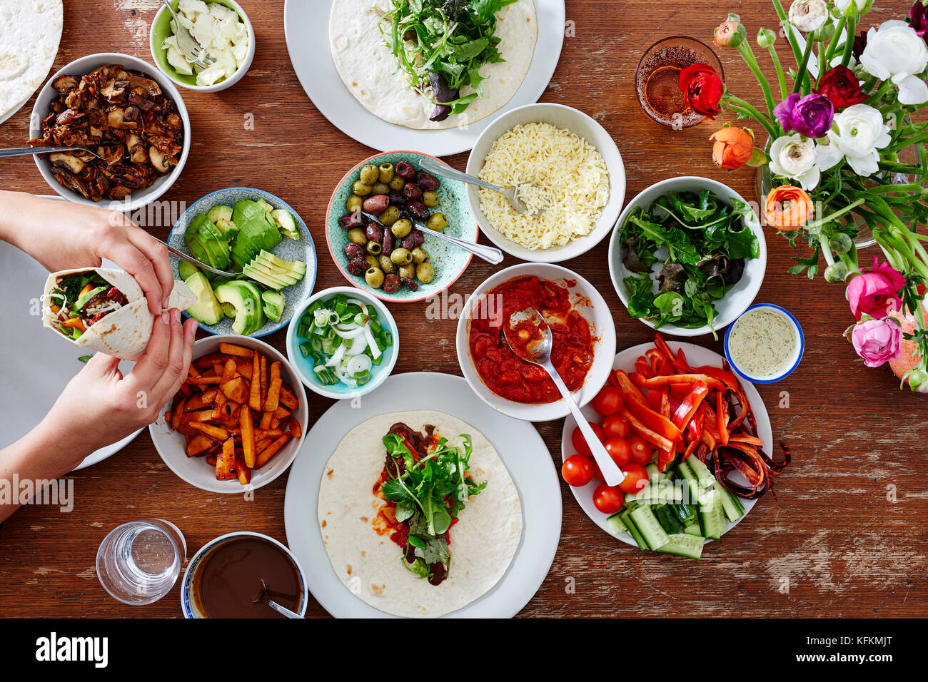 person eating self made wrap delicious healthy organic Stock Photo - Alamy