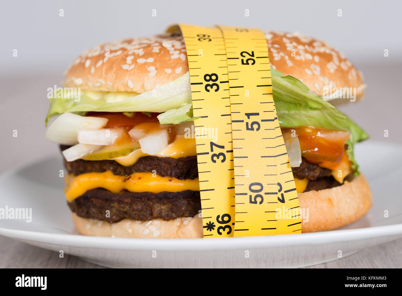 Cheeseburger with tape measure hi-res stock photography and images - Alamy