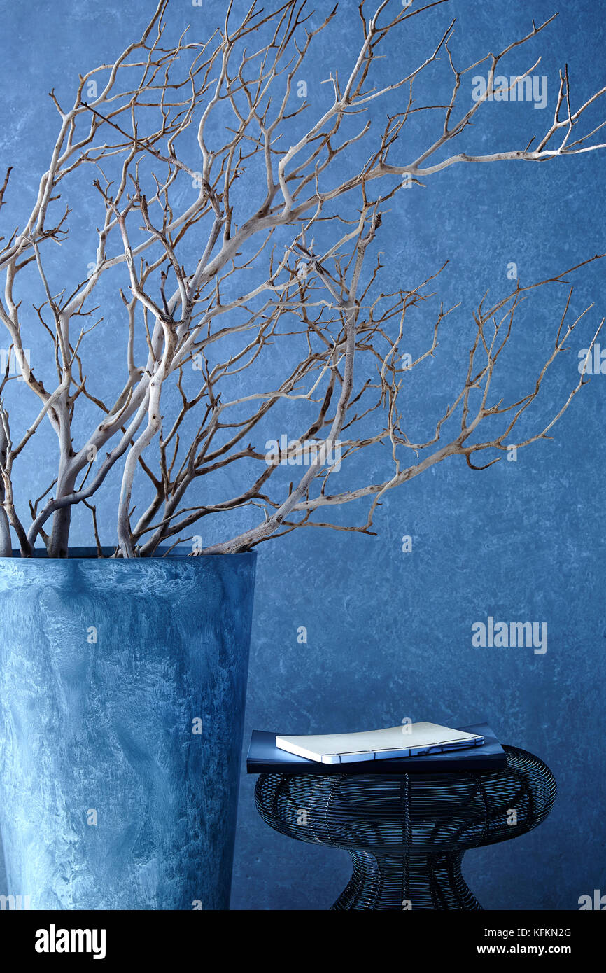 modern interior branches in front of concrete wall Stock Photo - Alamy