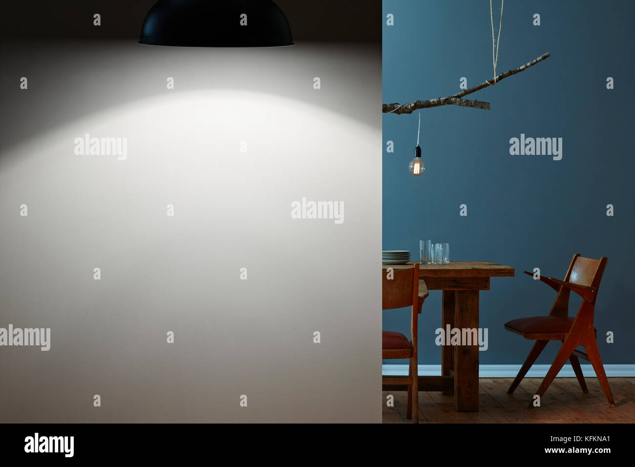 two rooms at night dining table and concept lamp Stock Photo - Alamy