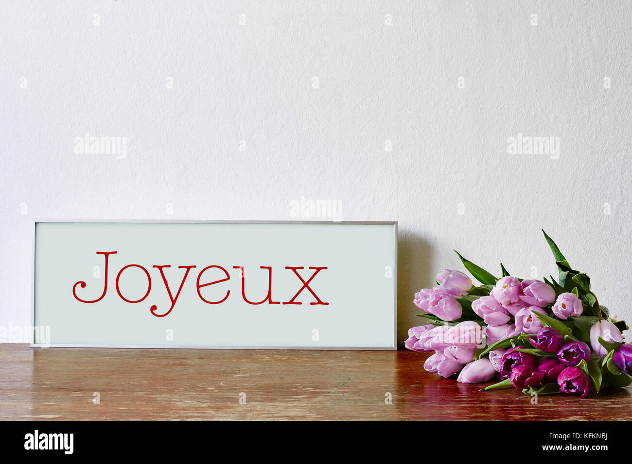 flowers and happy sign on table Stock Photo - Alamy