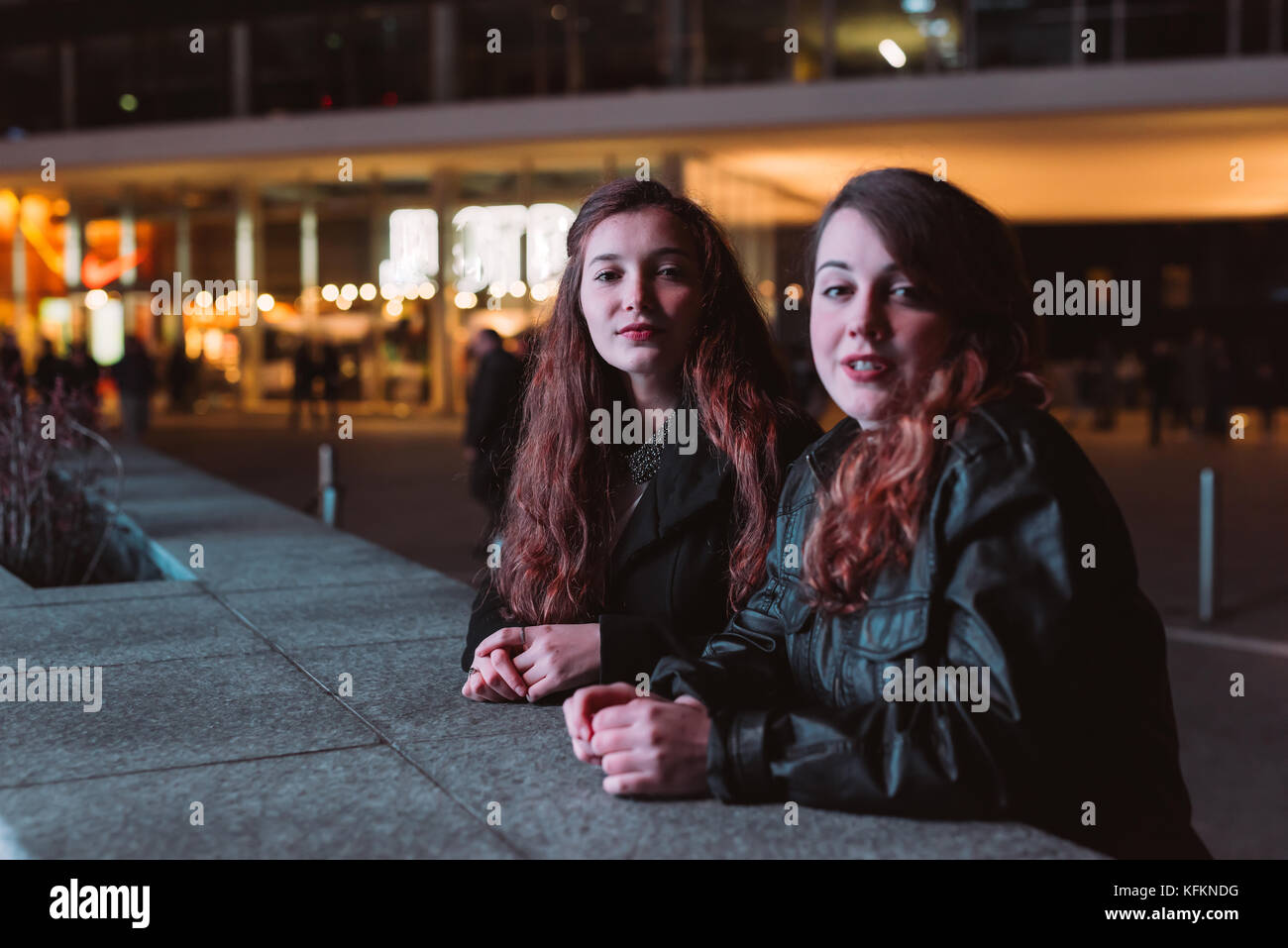 two young women beautiful outdoor posing looking camera - freindship ...