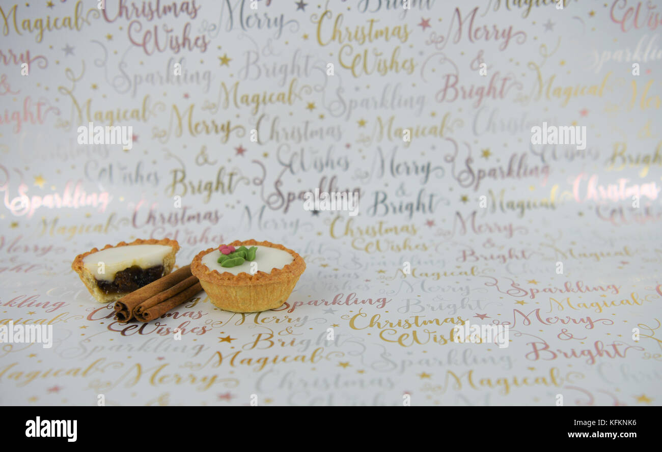 Christmas food photography image of mince pie pies with cinnamon sticks ...