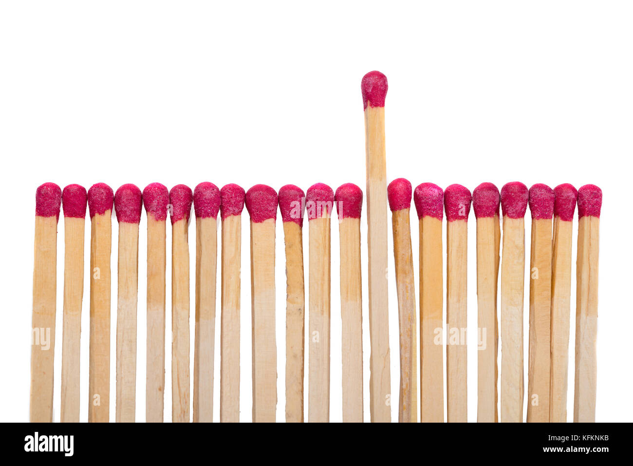 Row of match sticks with one coming up against white background Stock ...