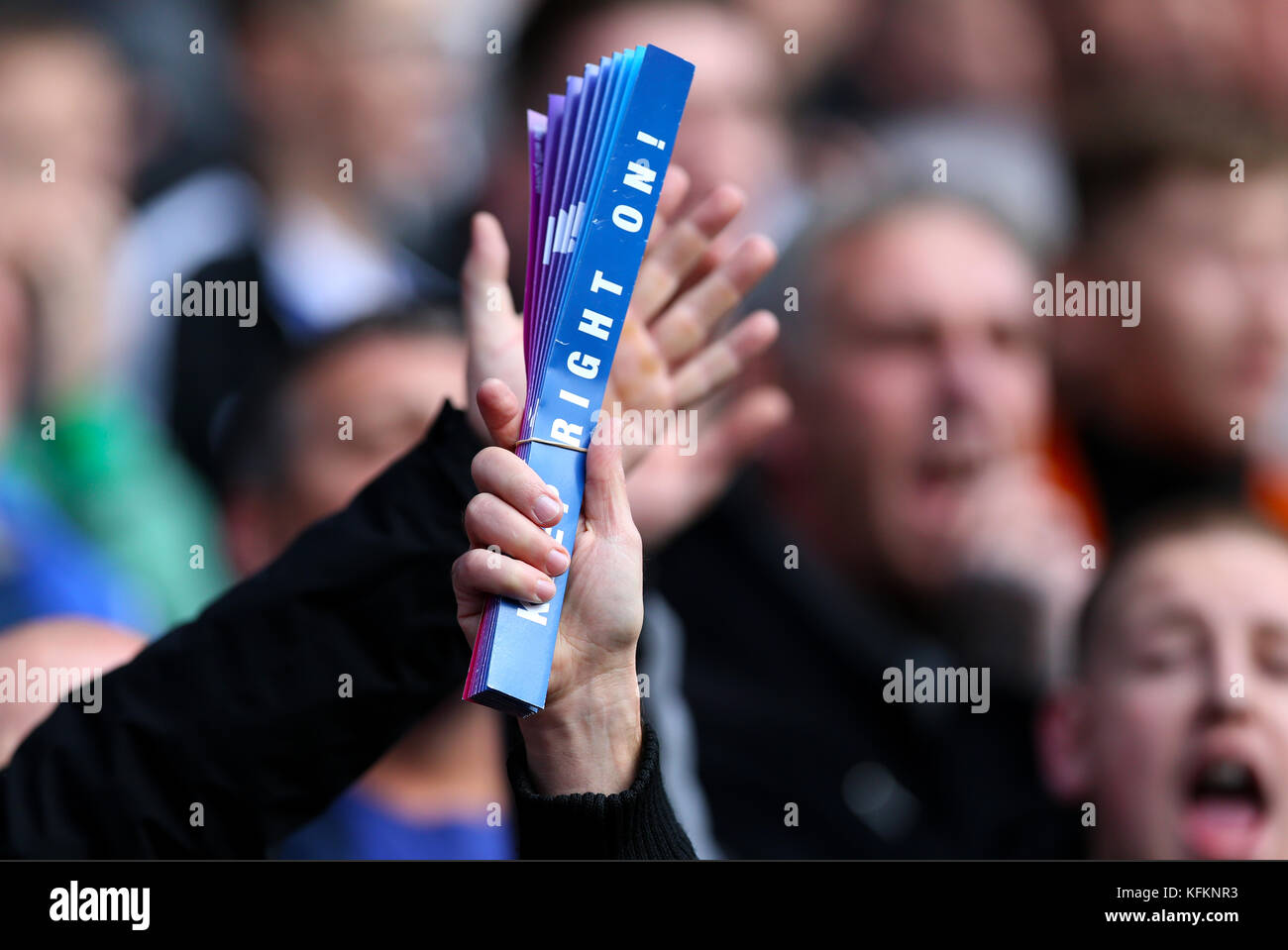 Fans hold flyers in the stands Stock Photo - Alamy