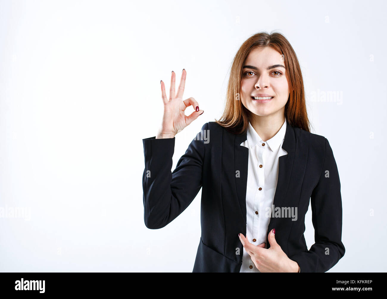 Businesswoman Shows OK Sign Stock Photo - Alamy