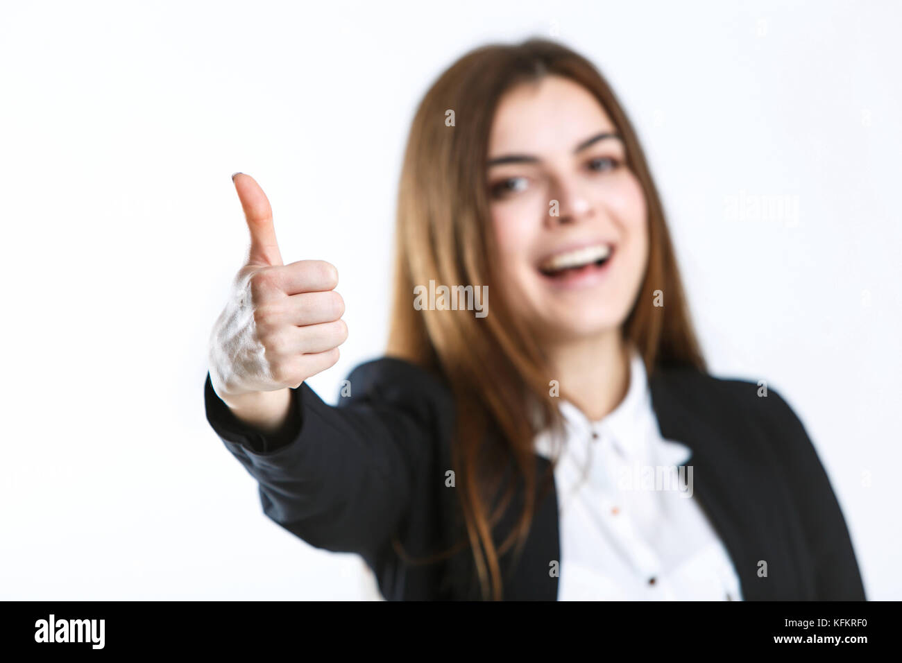 Businesswoman Shows Thumb Up Sign Stock Photo - Alamy