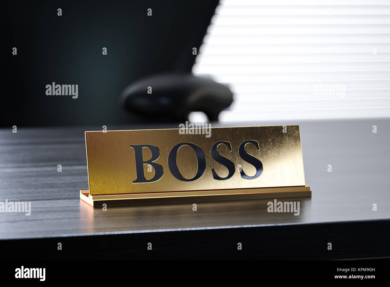 Golden nameplate with Boss text on the wooden table in the office ...