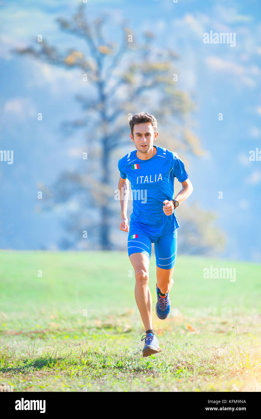 Athlete running in the mountains of the Italian national team in ...