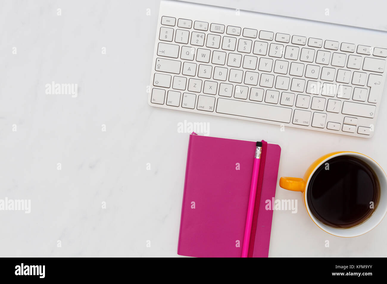 Computer keyboard notebook and coffee cup with copy space on white ...