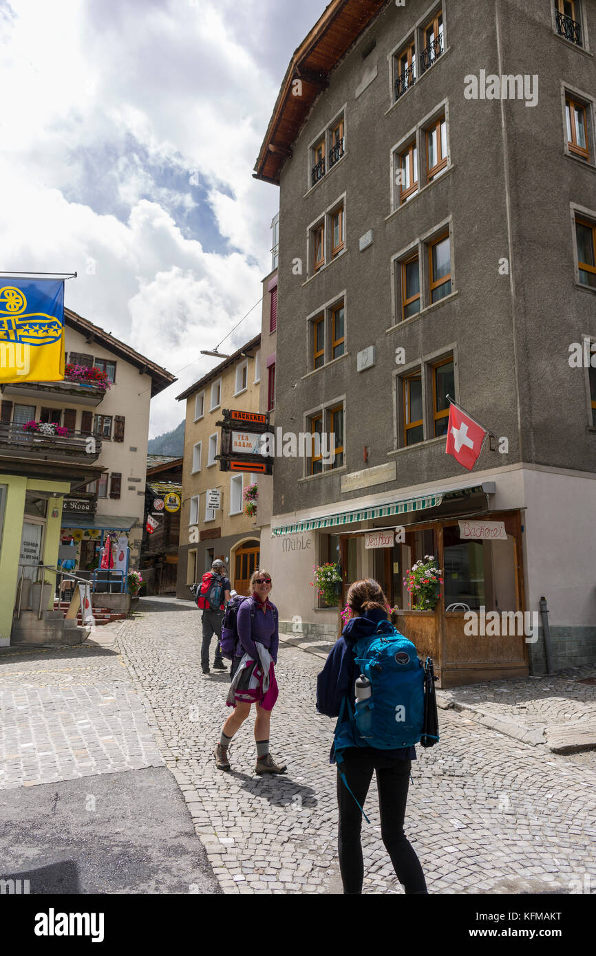 ST. NIKLAUS, SWITZERLAND - Tourists on street in village Stock Photo ...