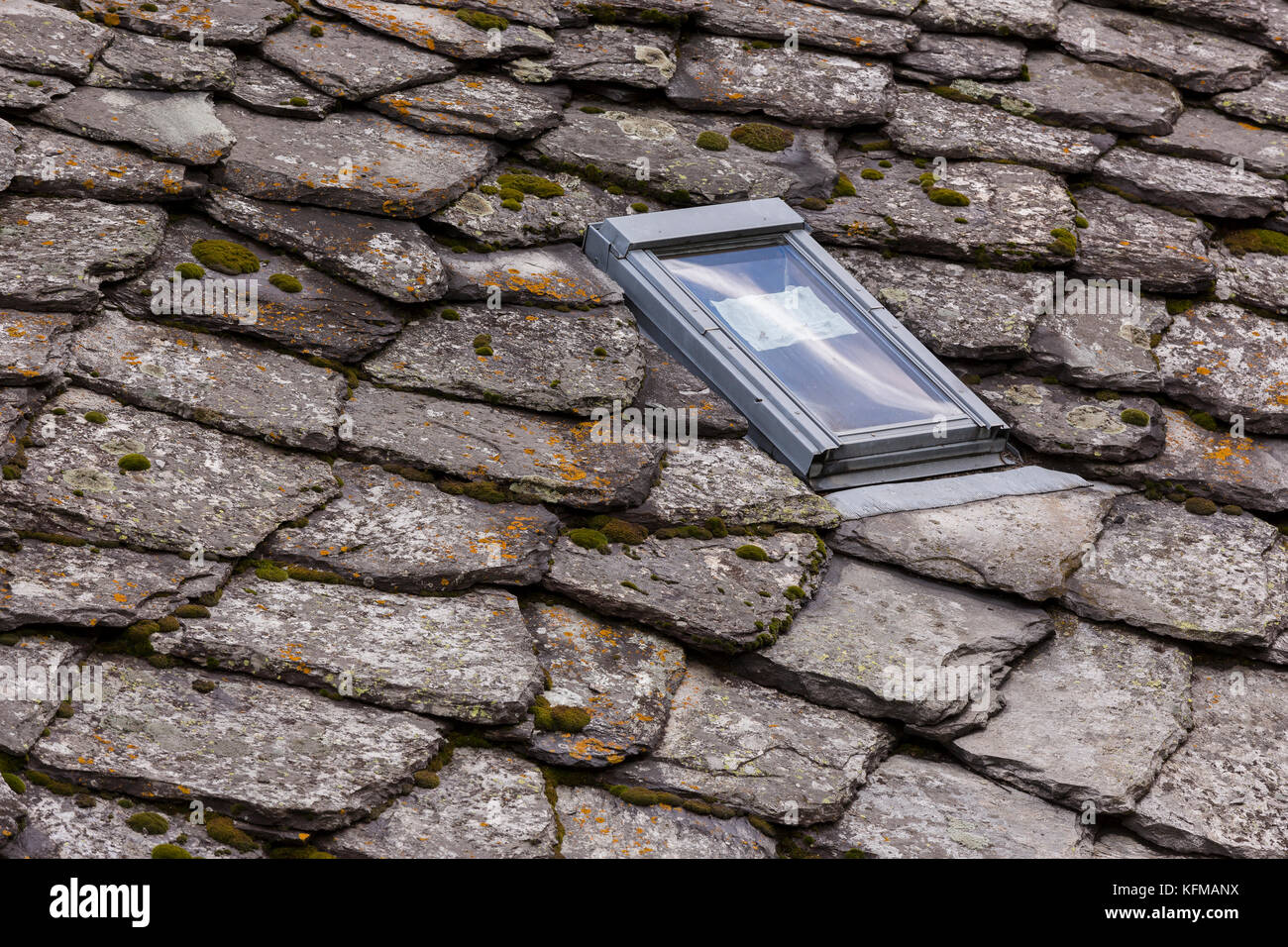 ST. NIKLAUS, SWITZERLAND - Modern skylight in traditional slate roof on ...