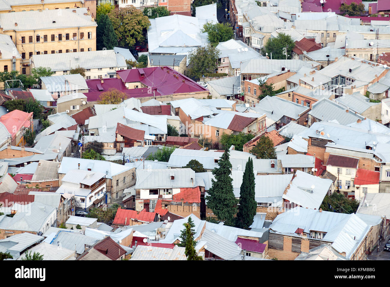 Dense urban development - a view of the roofs of houses from above ...