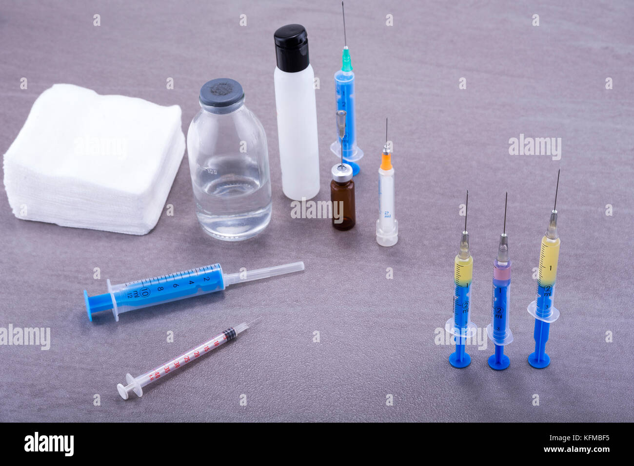 Shots and disinfectant on table. Full injections stand up Stock Photo ...
