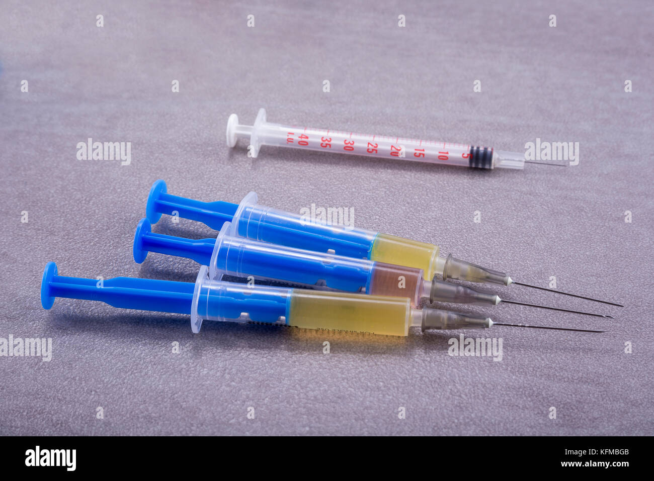 Plastic shots for one use ready to inject to human body Stock Photo - Alamy