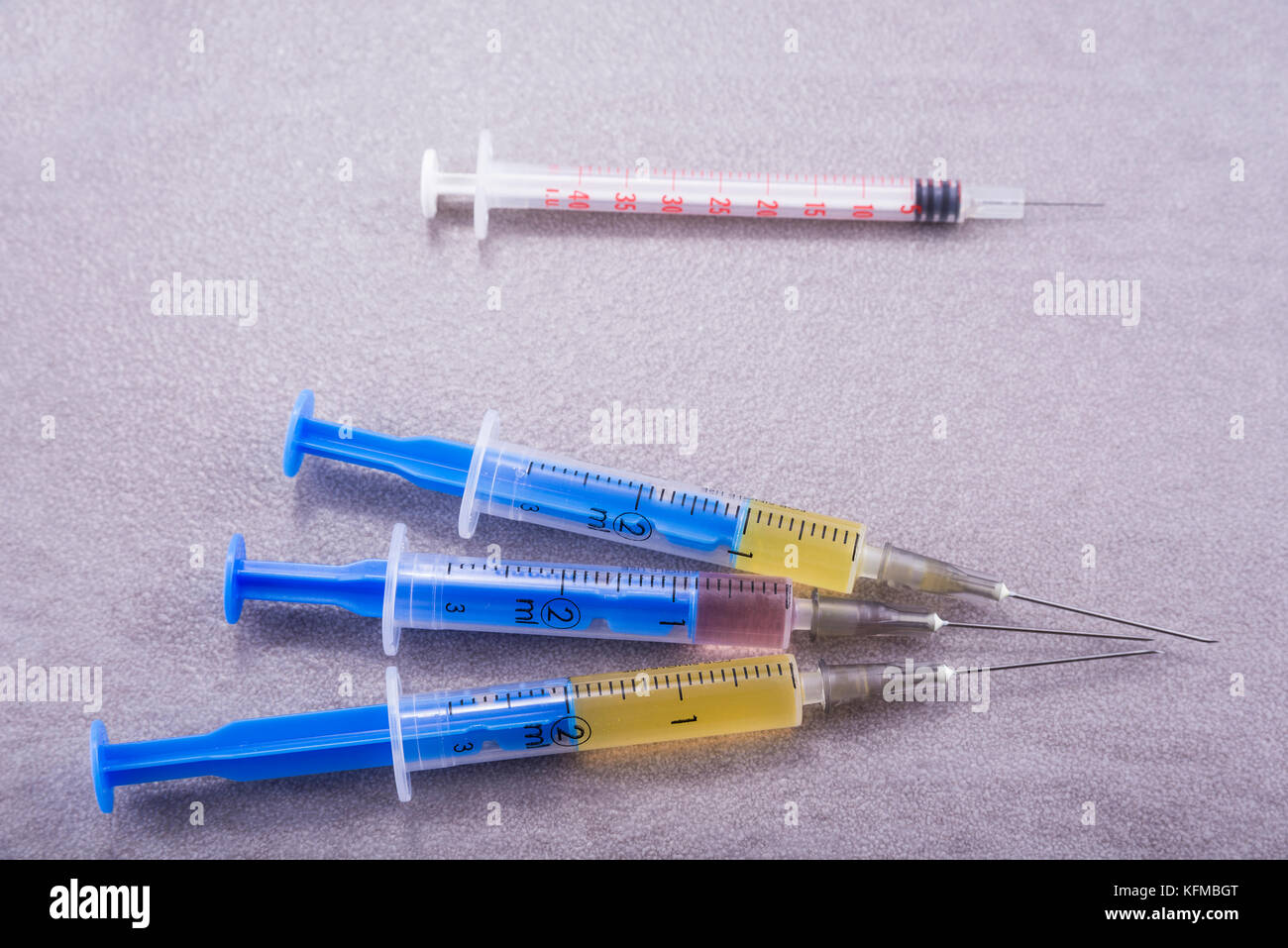 Three full injections ready to make shot on table Stock Photo - Alamy