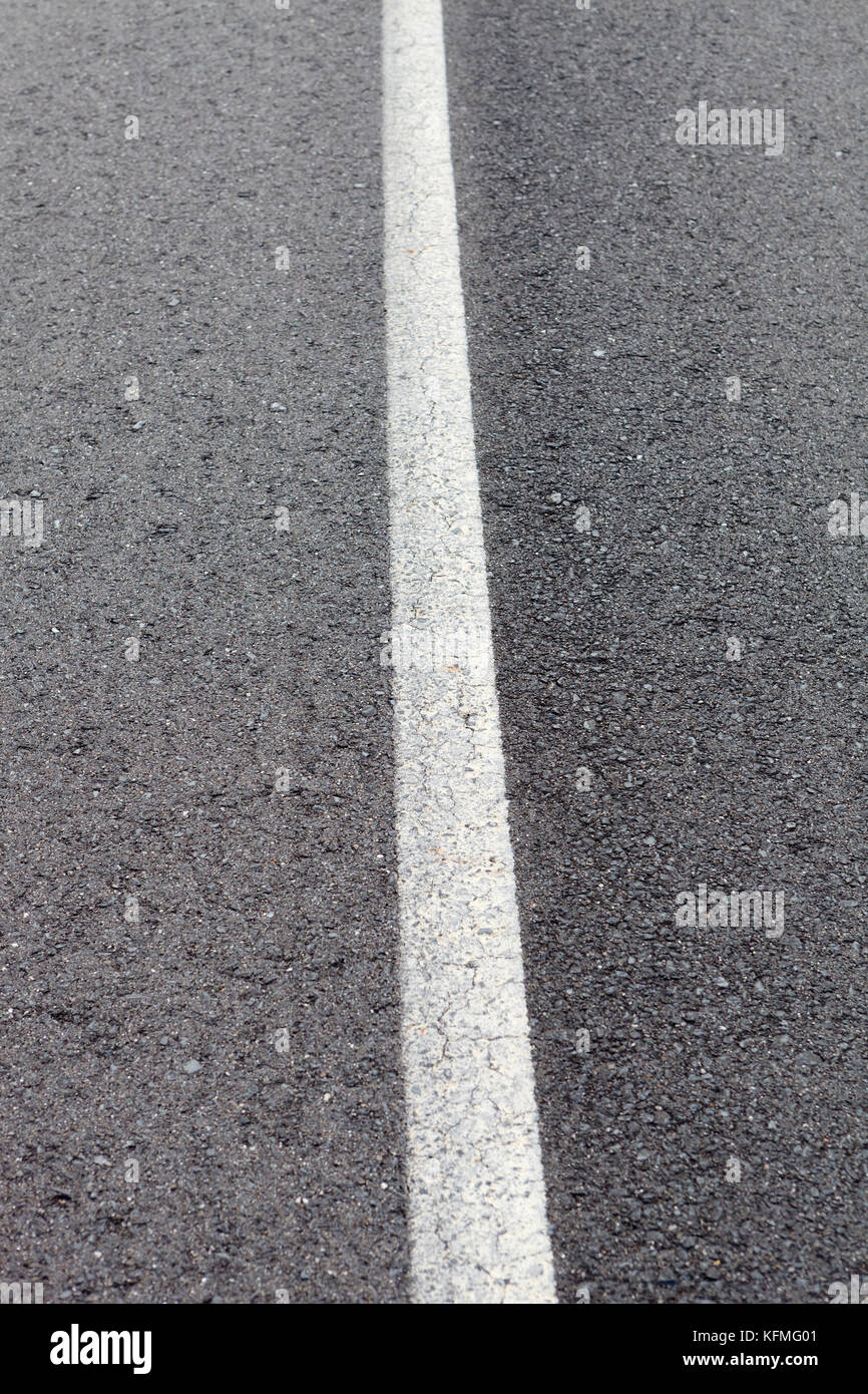 View of a road with a white line Stock Photo - Alamy