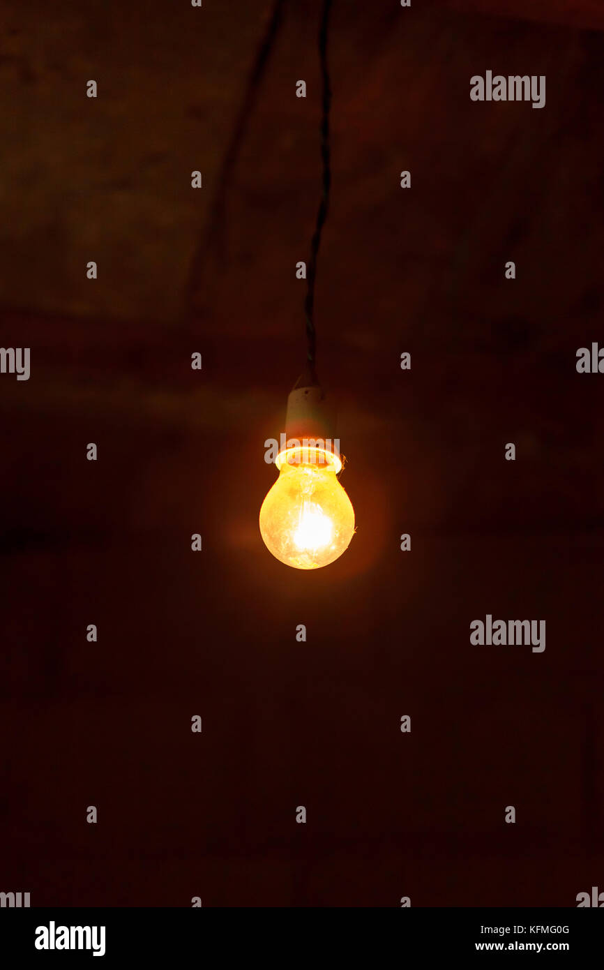 Light bulb hanging of an electrical cable Stock Photo - Alamy