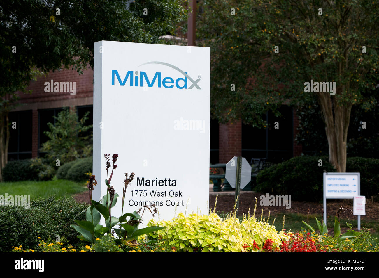 A logo sign outside of the headquarters of MiMedx in Marietta, Georgia ...