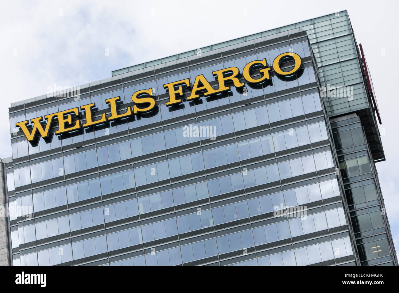 A logo sign outside of a facility occupied by Wells Fargo & Company in ...