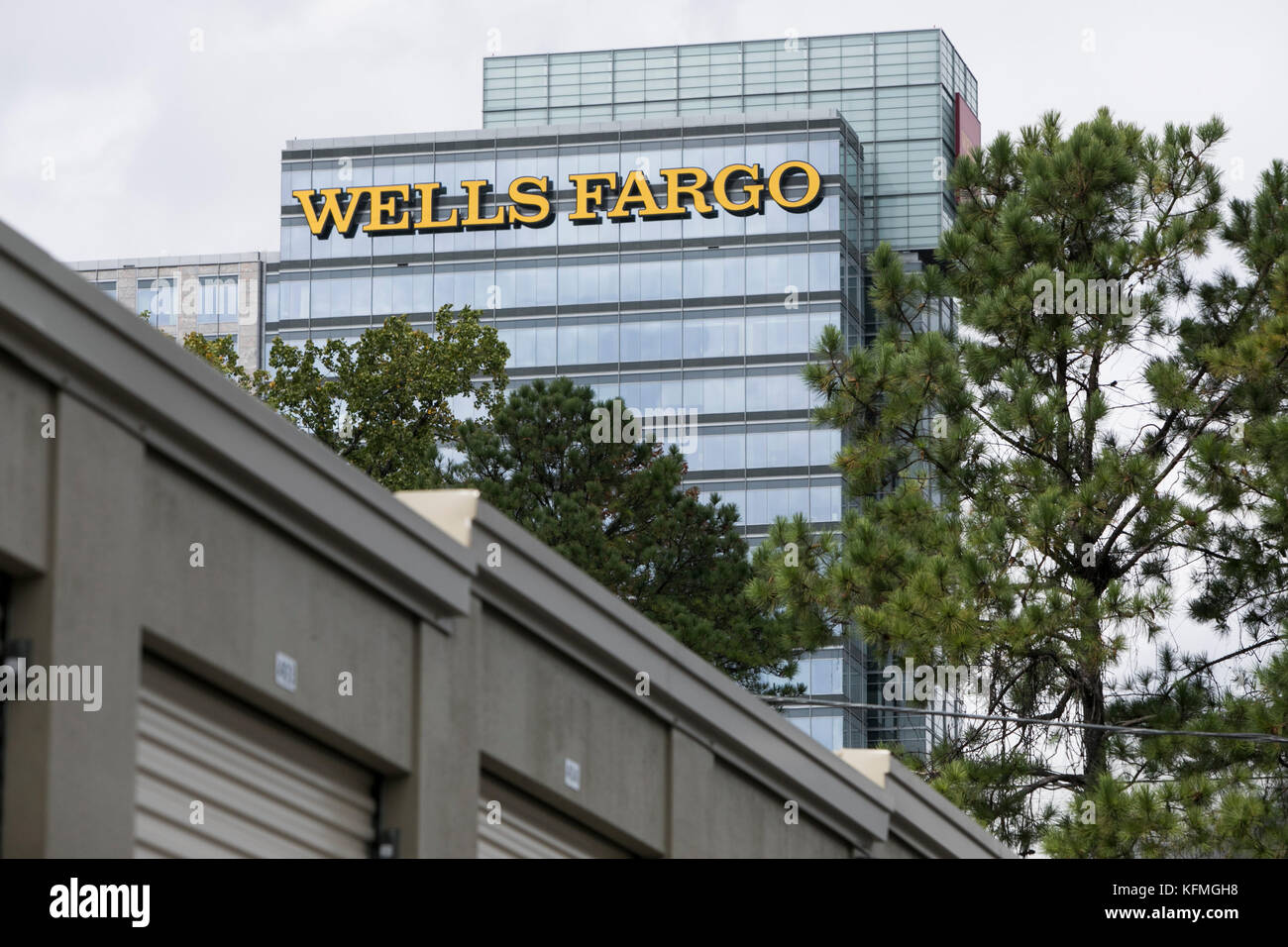 A logo sign outside of a facility occupied by Wells Fargo & Company in ...