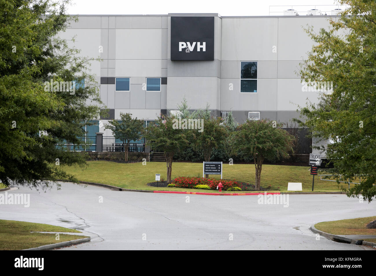A logo sign outside of a facility occupied by the PVH Corporation ...