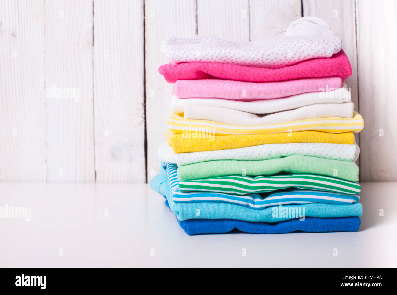 Folded baby clothes Stock Photo - Alamy