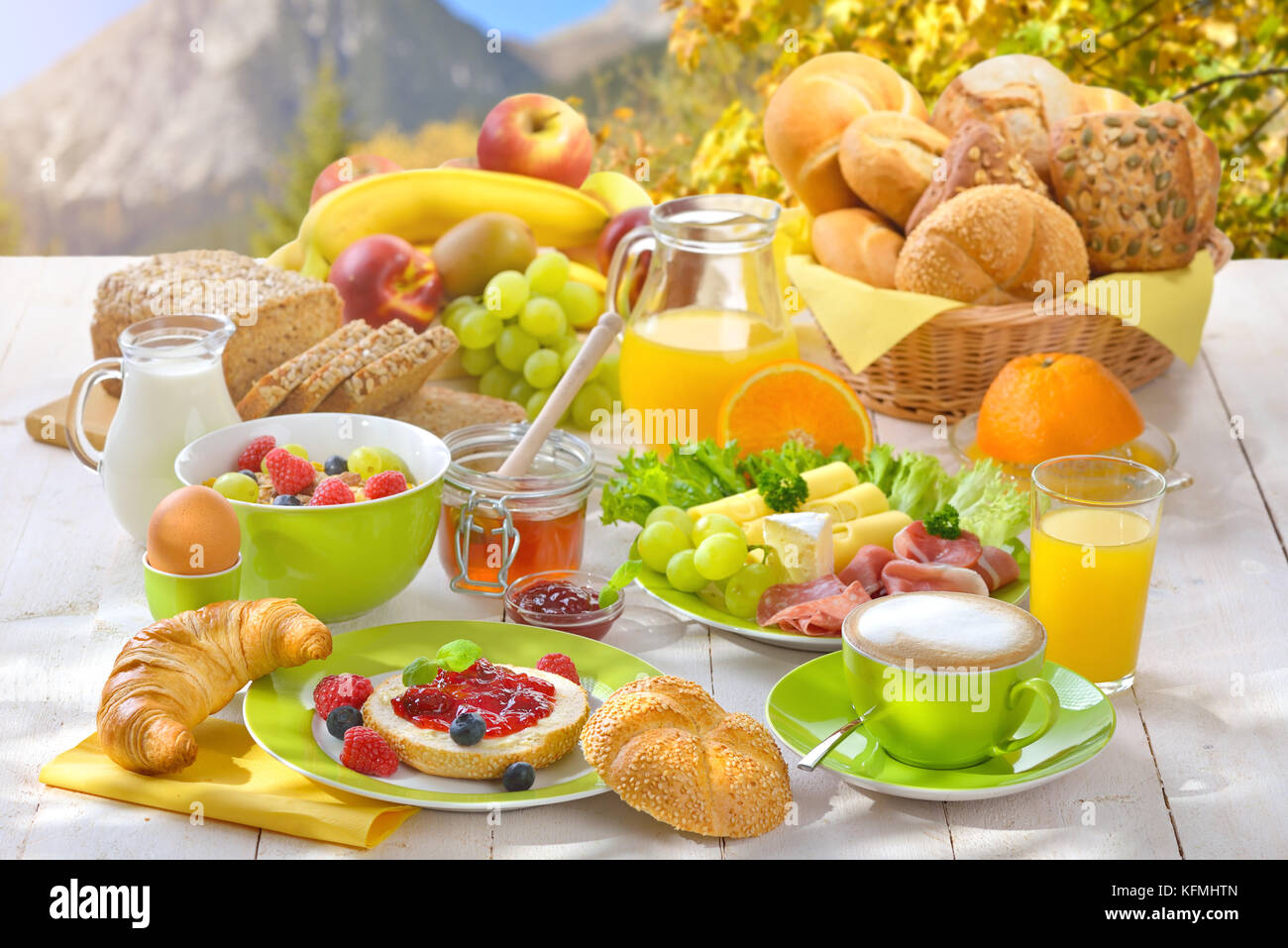 Outside served breakfast with a cup of cappuccino and a large selection ...