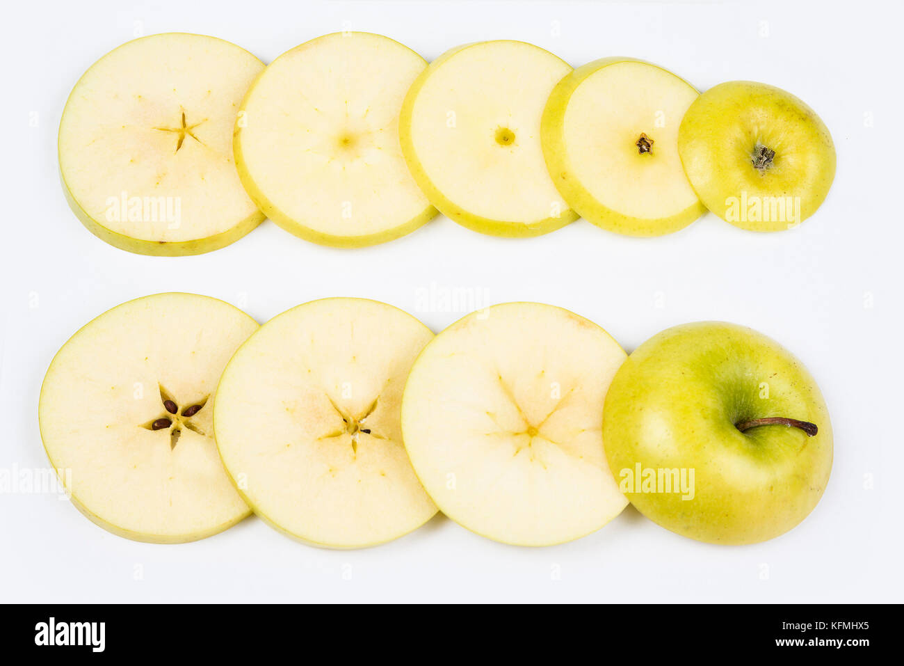 Apple cut on thin slices on white background Stock Photo - Alamy