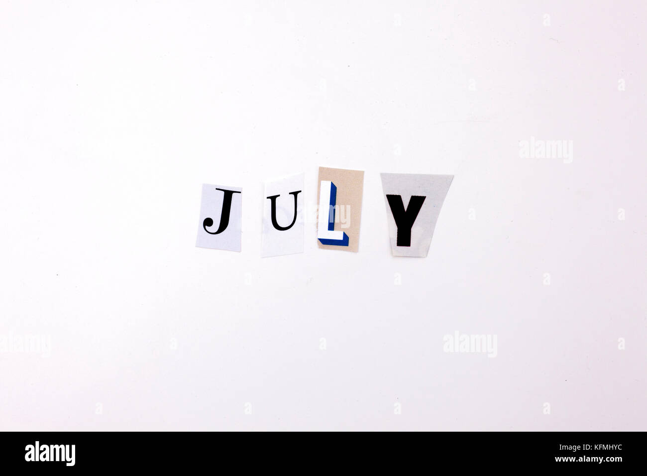 A word writing text showing concept of JULY made of different magazine ...