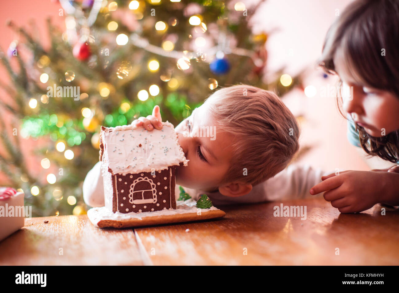 Little boys with gingerbread house Stock Photo - Alamy