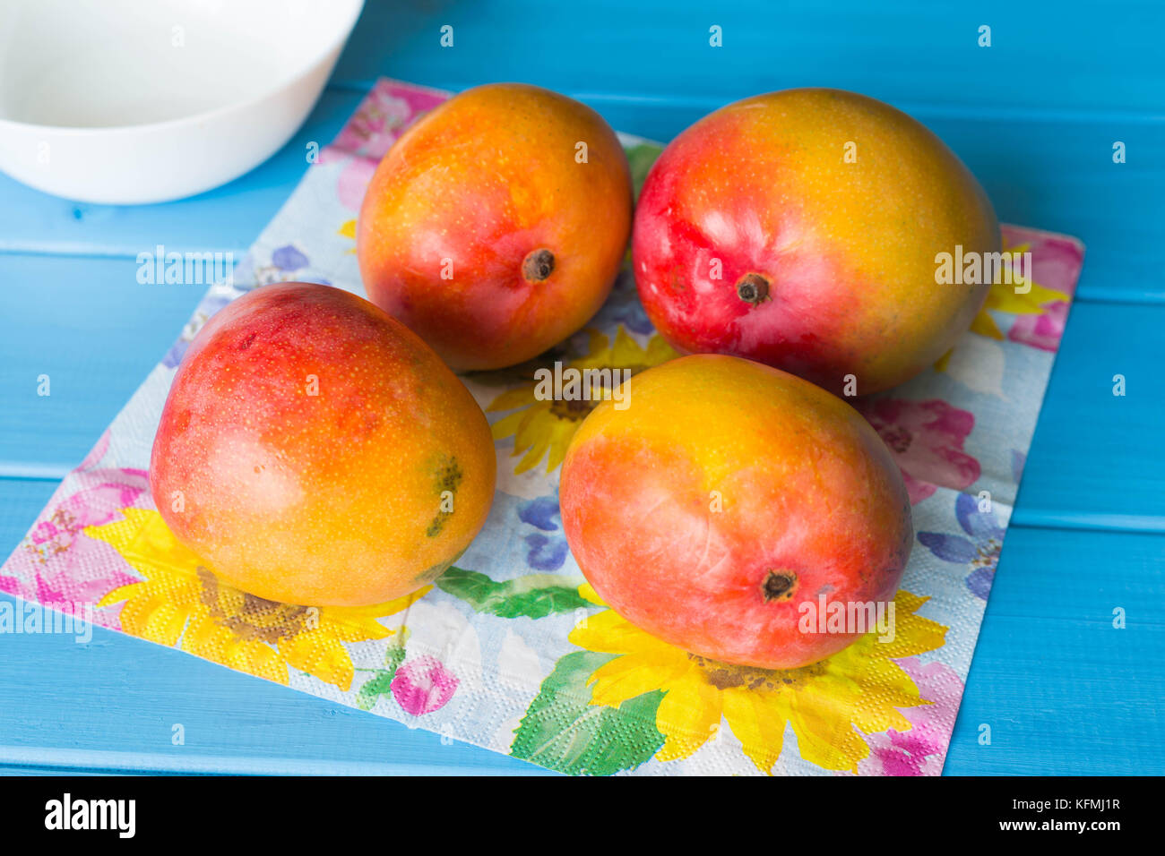 mango fruits of the blue table Stock Photo - Alamy