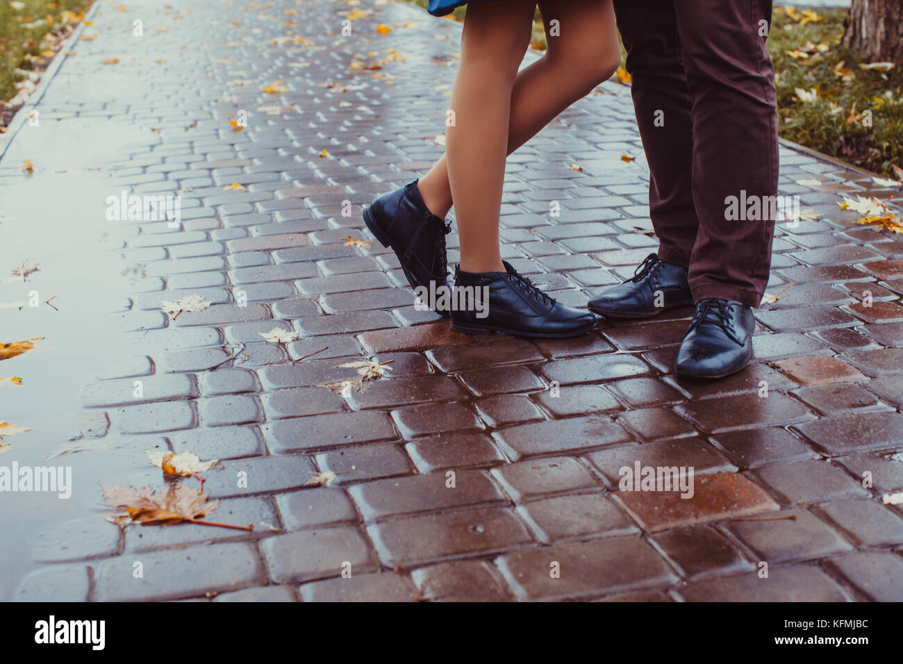 Legs of the kissing couple Stock Photo - Alamy