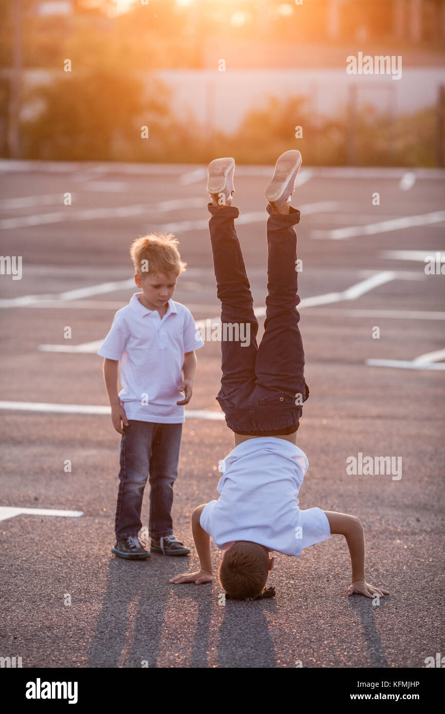 The boy standing upside down Stock Photo - Alamy